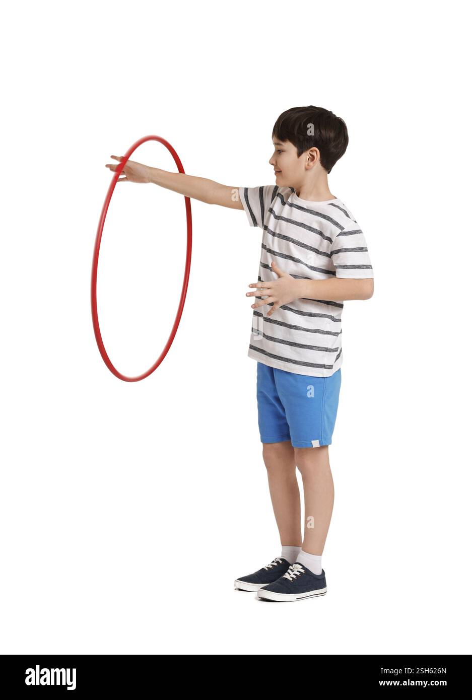 Boy exercising with hula hoop on white background Stock Photo - Alamy