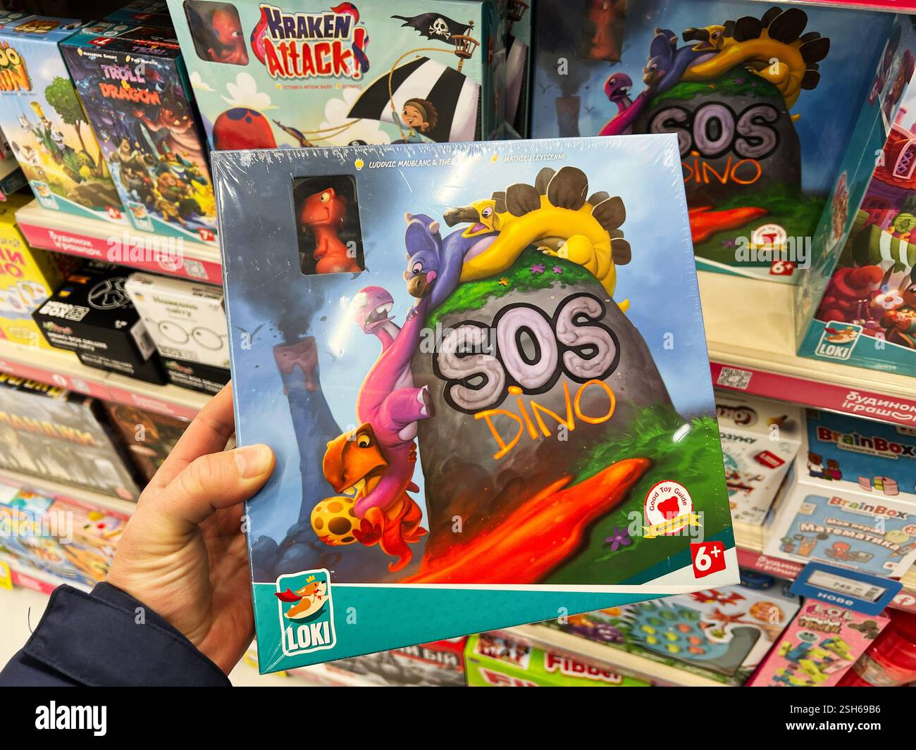 Kyiv, Ukraine - February 09, 2025: Colorful board game box SOS dino ...