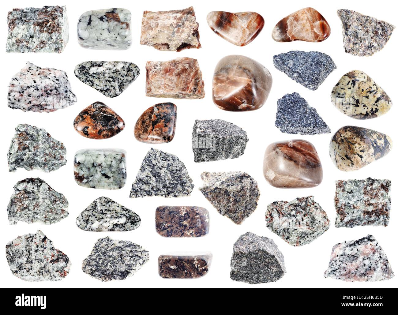 various specimens of uncut nepheline and nepheline syenite rocks cutout on white background ...