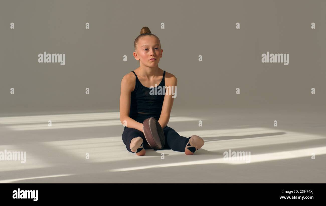 Sad bored offended upset daughter child kid little Caucasian sport girl ...