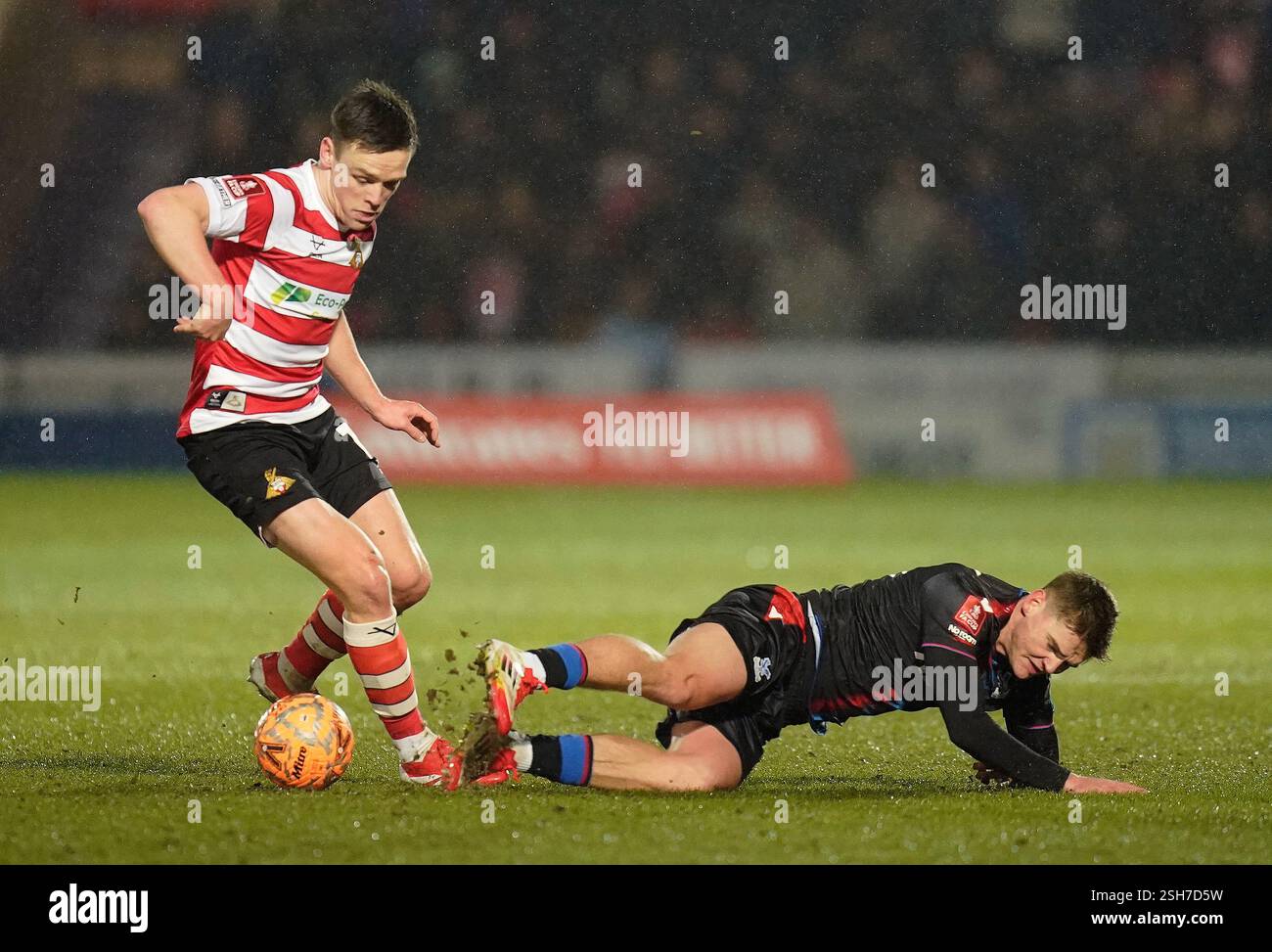 Doncaster Rovers' Owen Bailey (left) and Crystal Palace's Justin ...