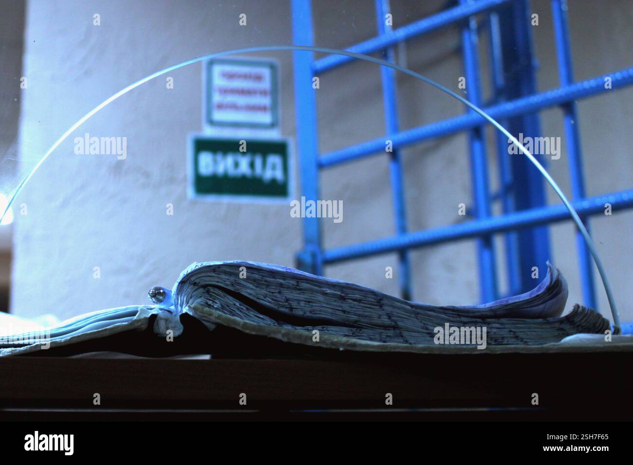 An old logbook for signatures of visit records lies at the checkpoint ...