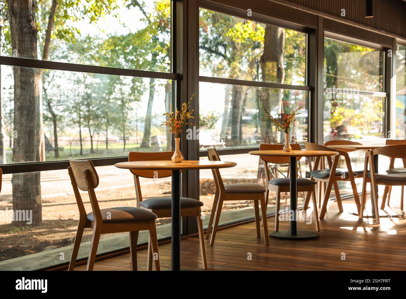 Stylish cafe with large windows. Interior design Stock Photo - Alamy