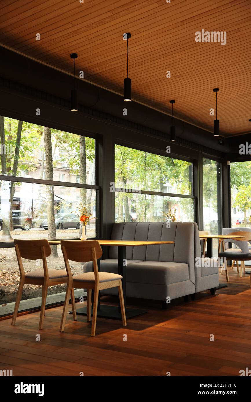 Stylish cafe with large windows. Interior design Stock Photo - Alamy