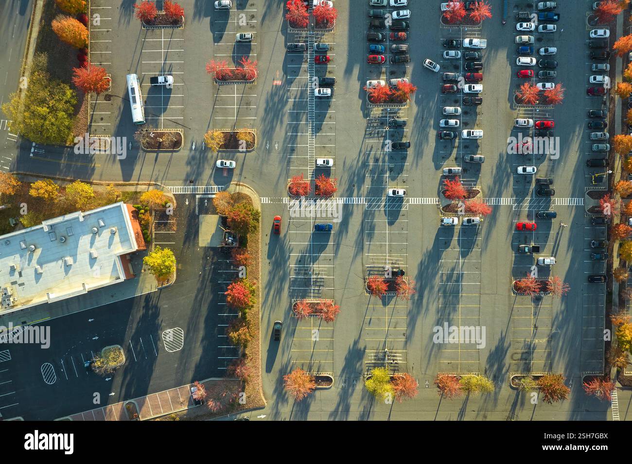 Aerial view of large parking lot with many parked colorful cars ...