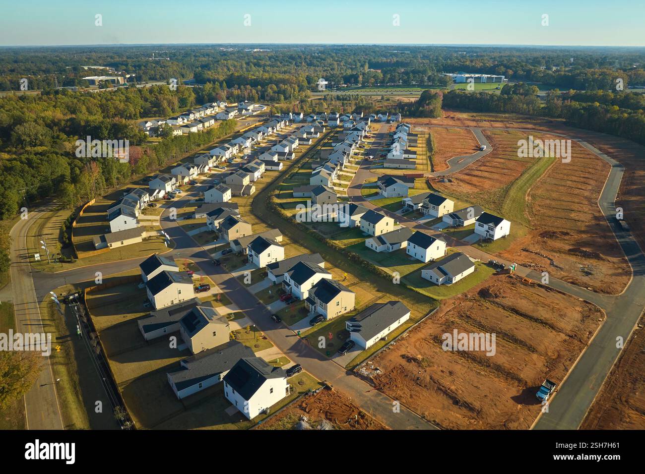 Aerial view of real estate development with tightly located family ...