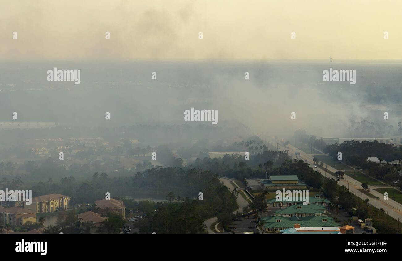 Aerial view of strong wildfire burning severely in North Port city ...