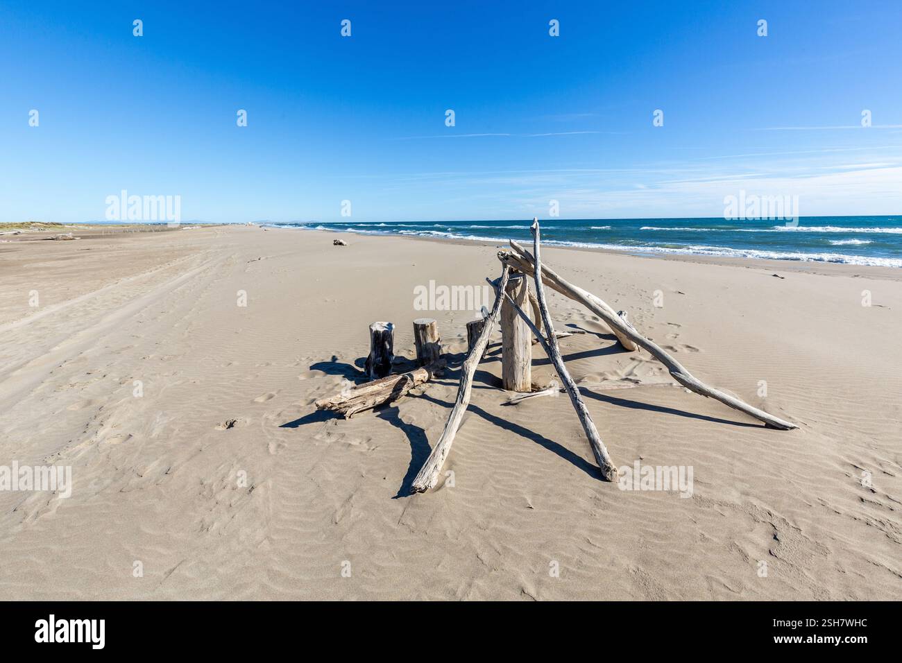 Wood debris forming the remains of a shelter on Piémanson beach in ...