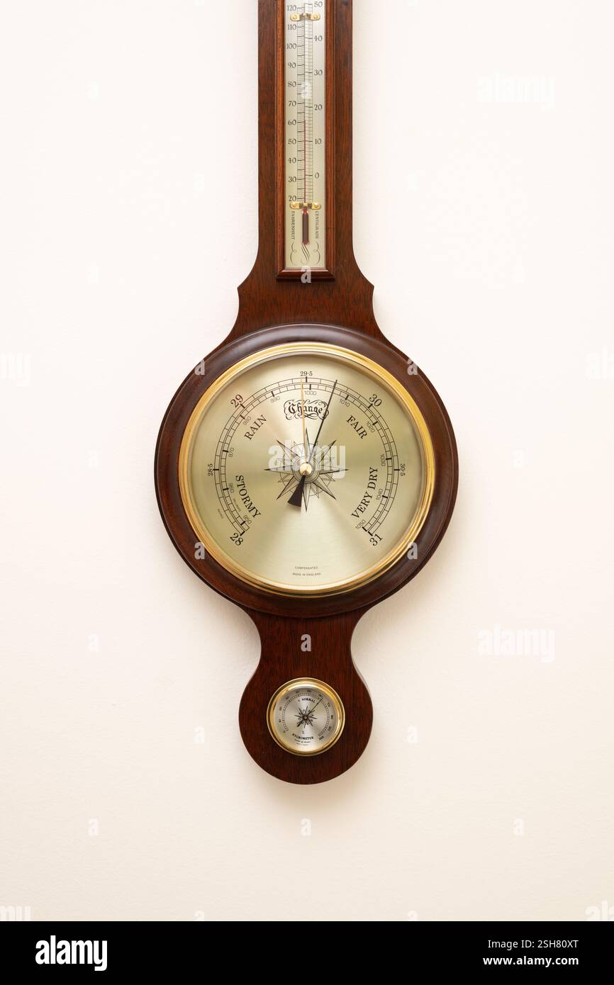 Close up of an aneroid barometer mounted on a wall Stock Photo - Alamy