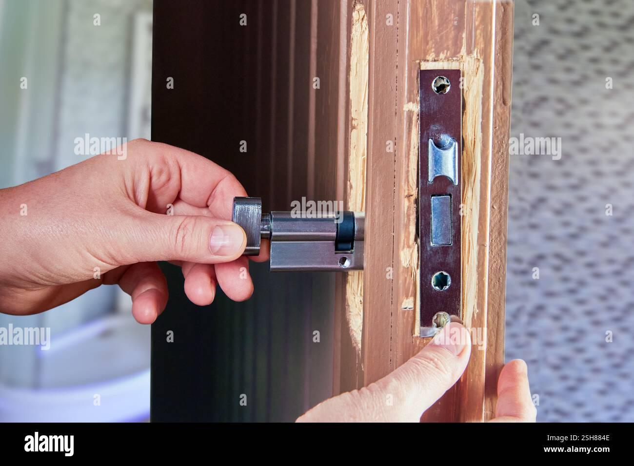Precision work during installation of mortice sash lock Stock Photo - Alamy