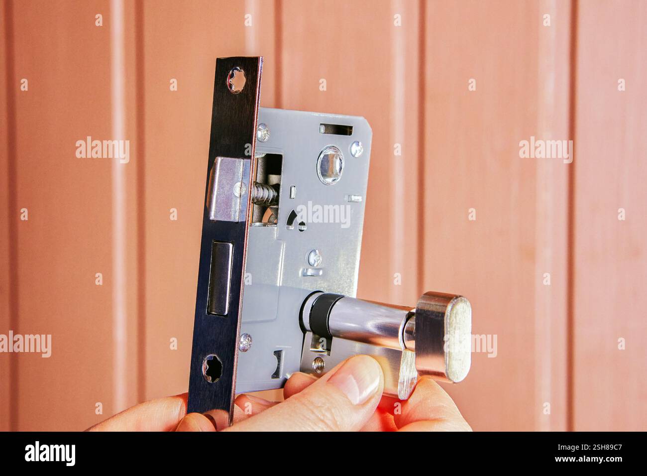 Mortice lock fitting process on internal door Stock Photo - Alamy