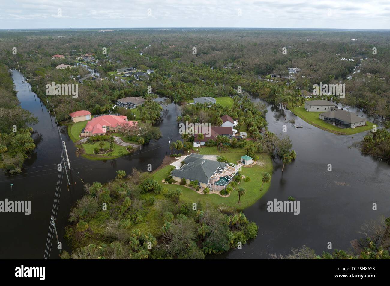 Surrounded by hurricane rainfall flood waters homes in Florida ...