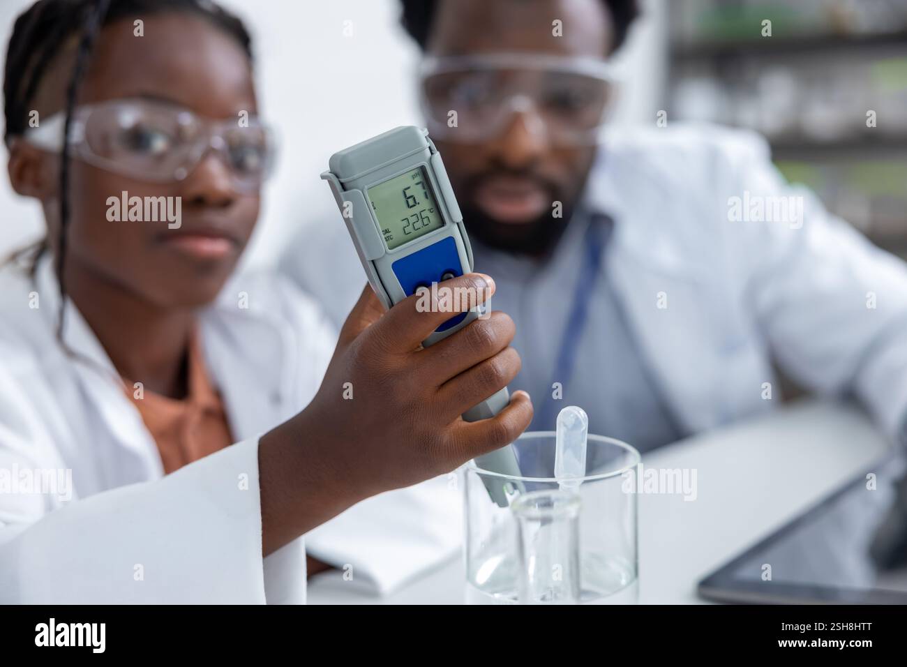 African american schoolgirl doing scientific experiments at the ...
