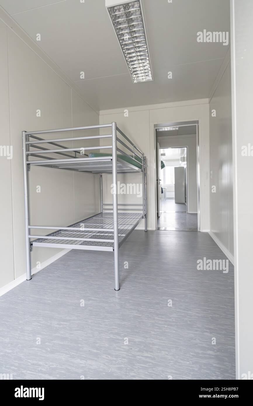 Empty room with a metal bunk bed, modern and simple, refugee ...