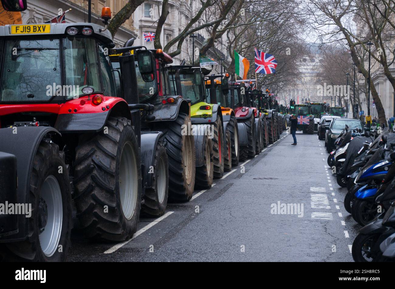 Line of farm tractors parked along London street near Trafalgar Square ...