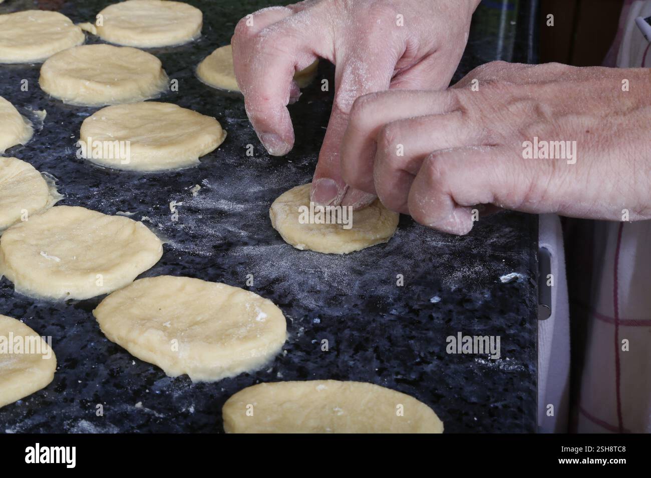 Swabian cuisine, preparation of harvest cakes, moulding raw dough ...