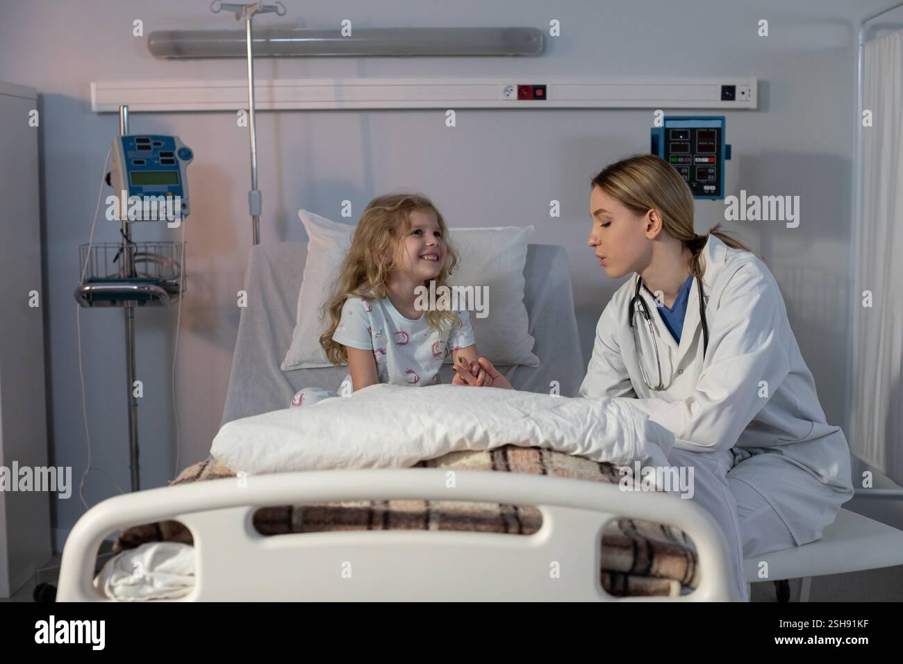 A Compassionate Doctor and a Happy Patient Together in a Hospital Room Environment Stock Photo ...