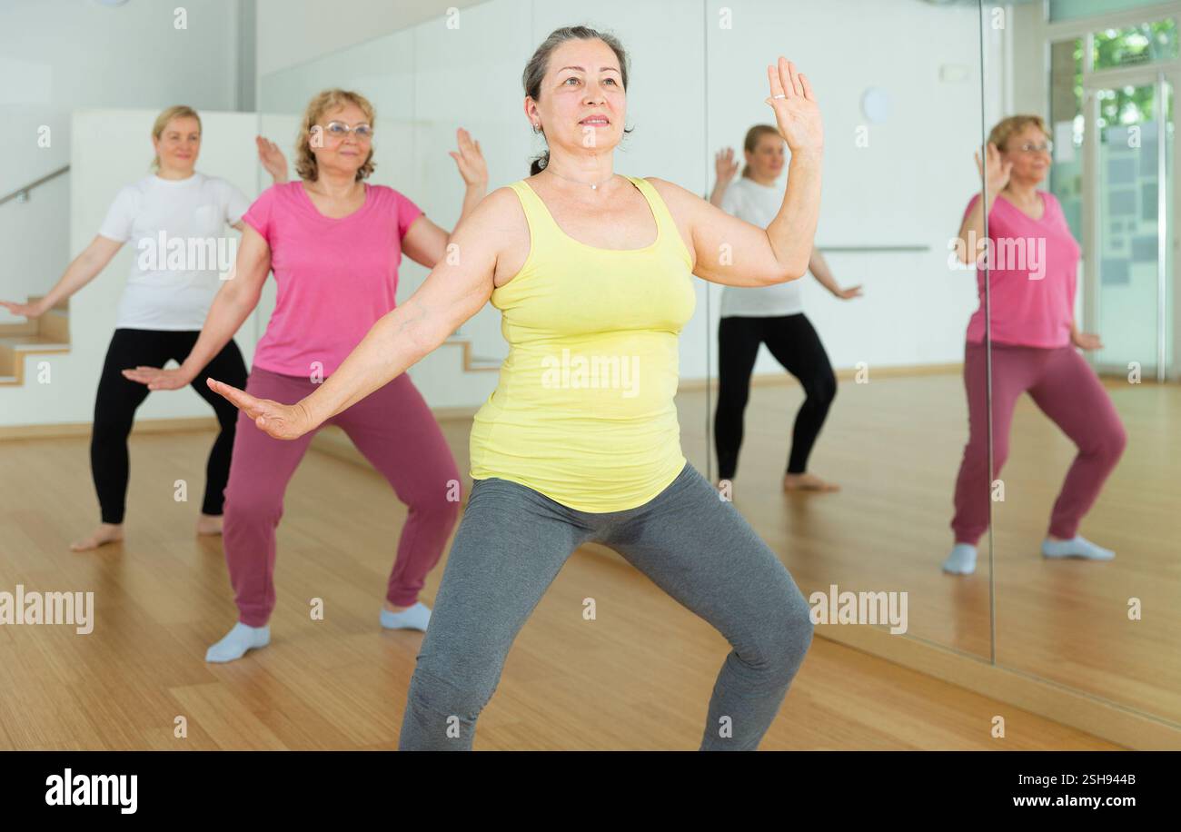 Mature women dancing aerobics at lesson in dance class Stock Photo - Alamy