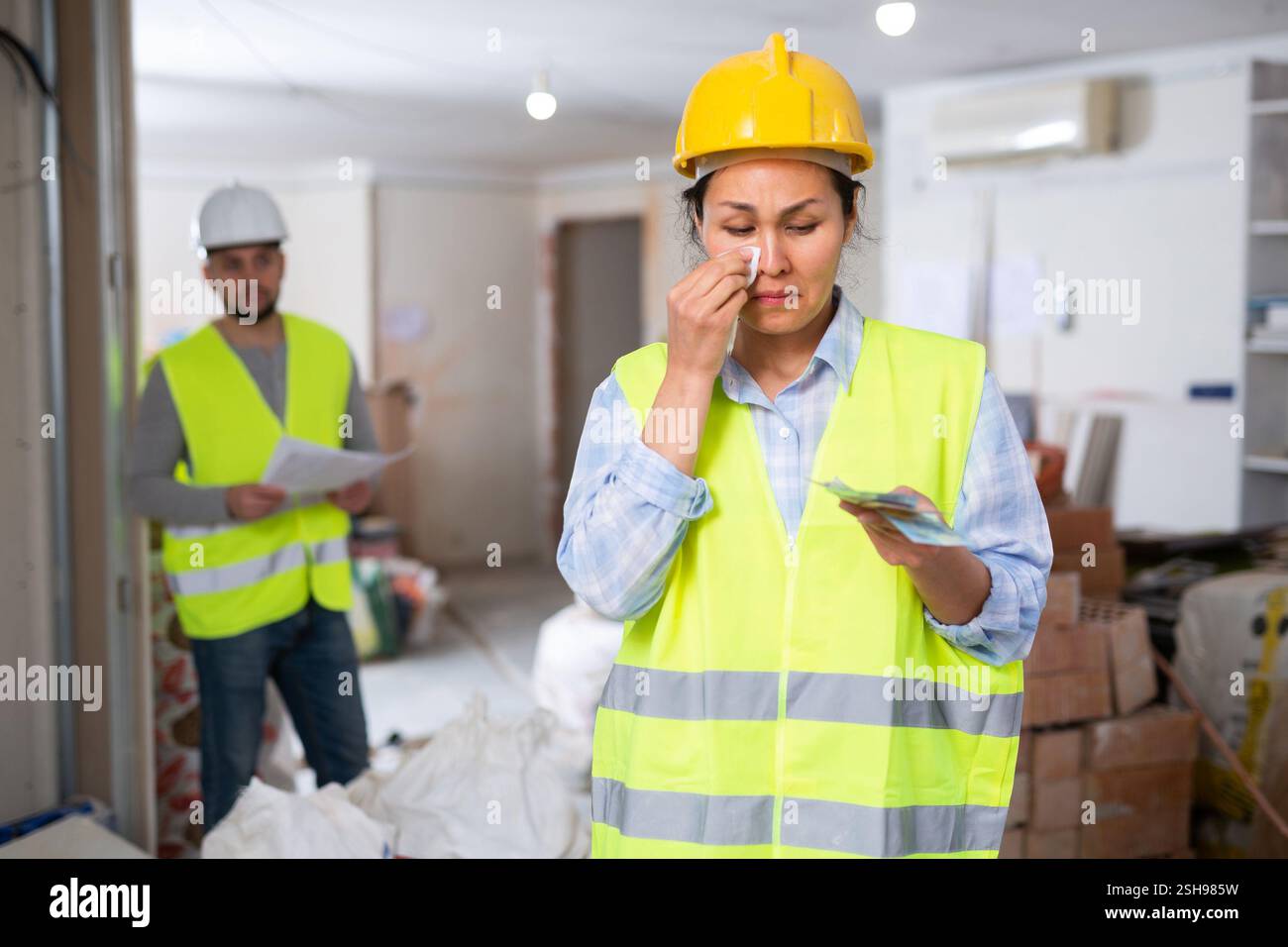 Woman engineer crying, disappointed by low salary Stock Photo - Alamy