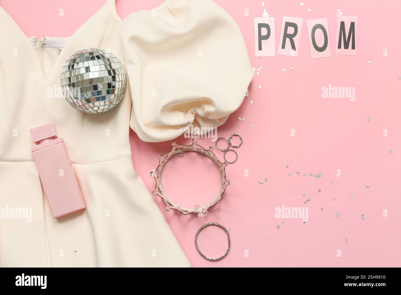 Word PROM with dress, crown and disco ball on pink background Stock ...