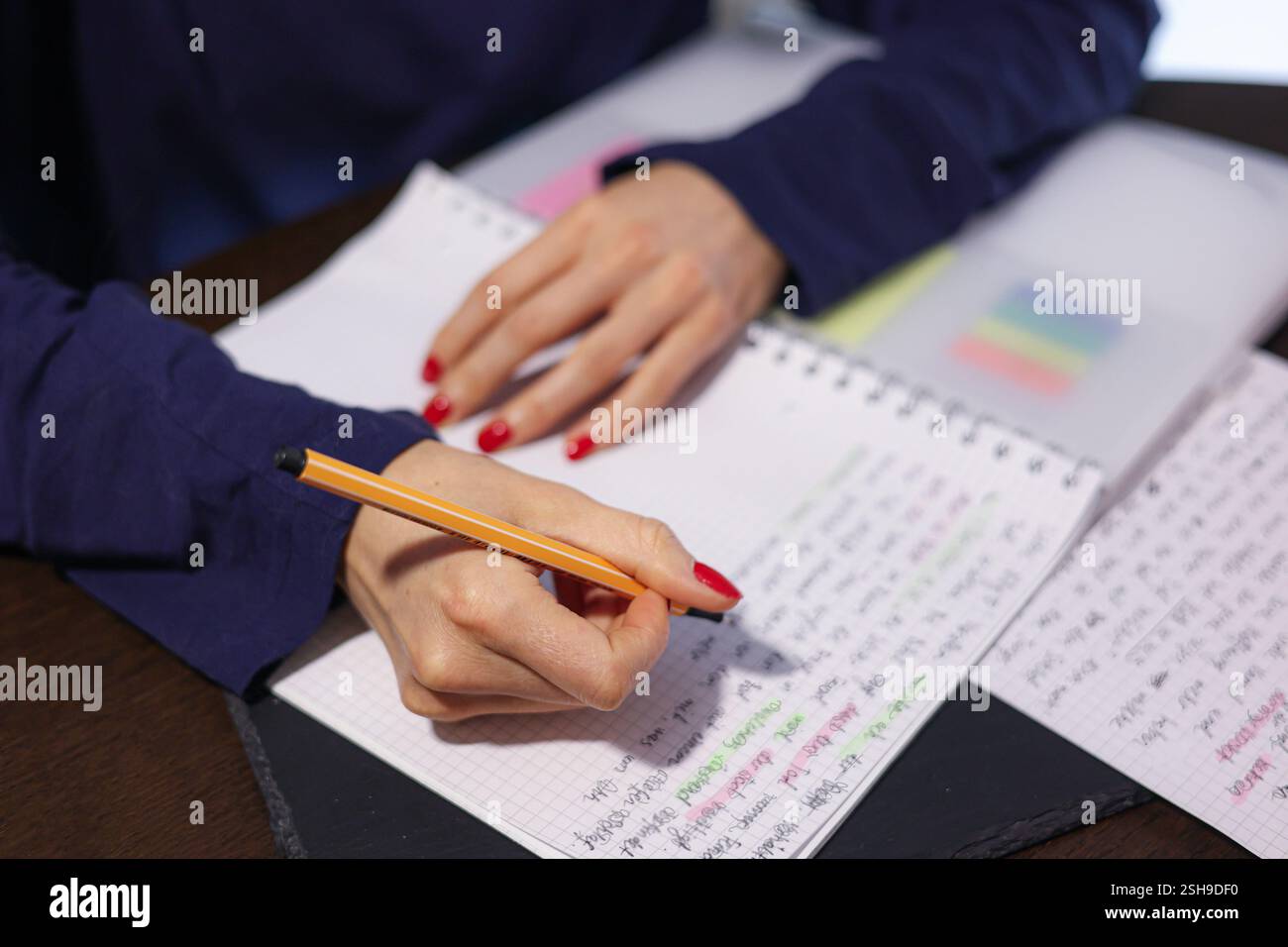 writes on the table in a notebook business people shaking hands takes ...