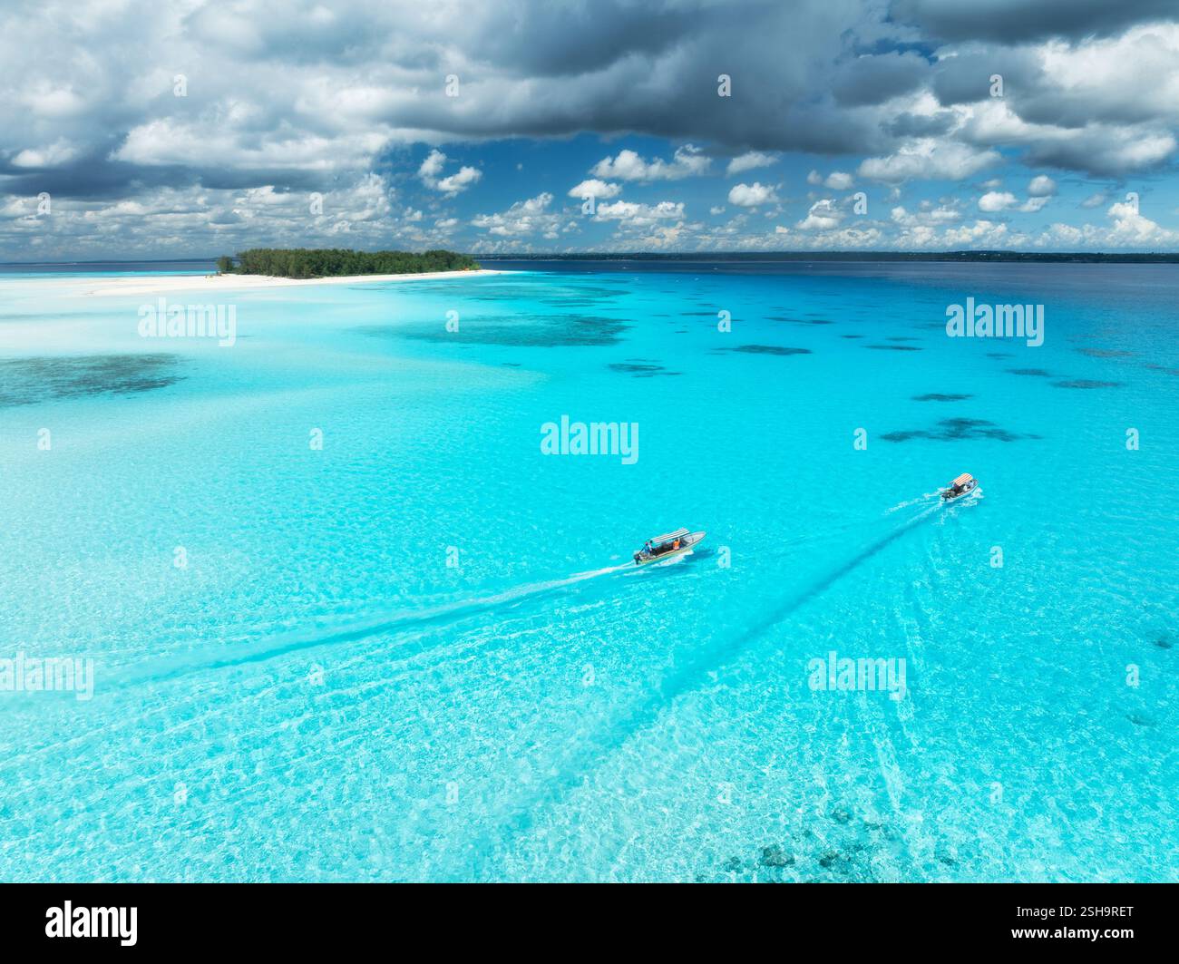 Aerial view of colorful boats in clear azure water in summer Stock ...