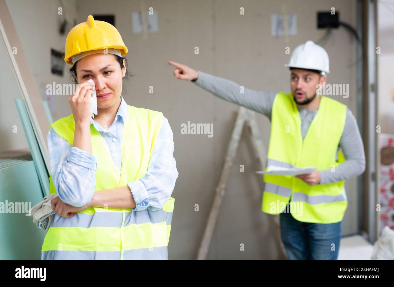 Woman engineer crying because she has been fired by her foreman Stock ...