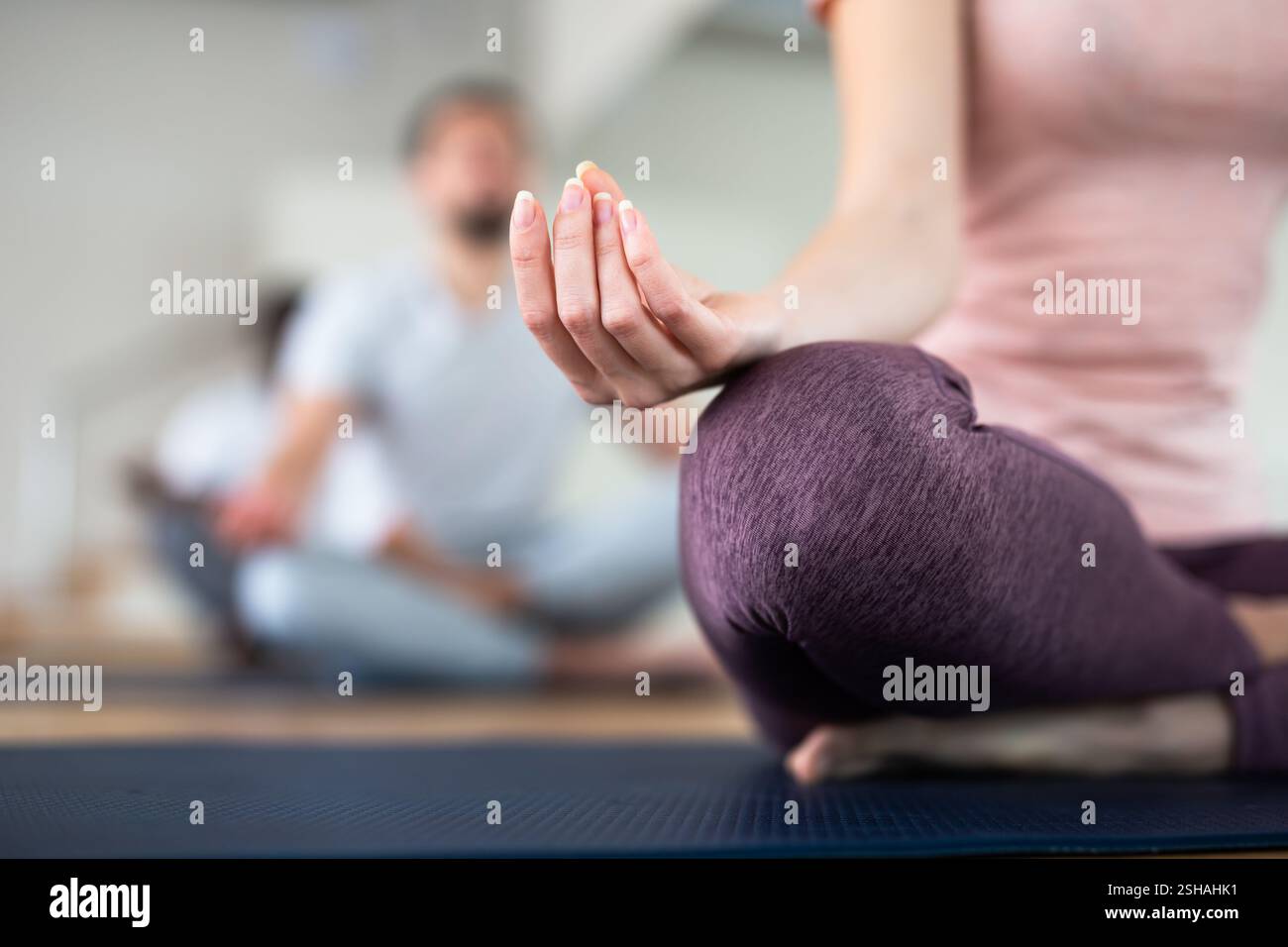 Woman meditating in lotus position with hands folded in mudra Stock ...