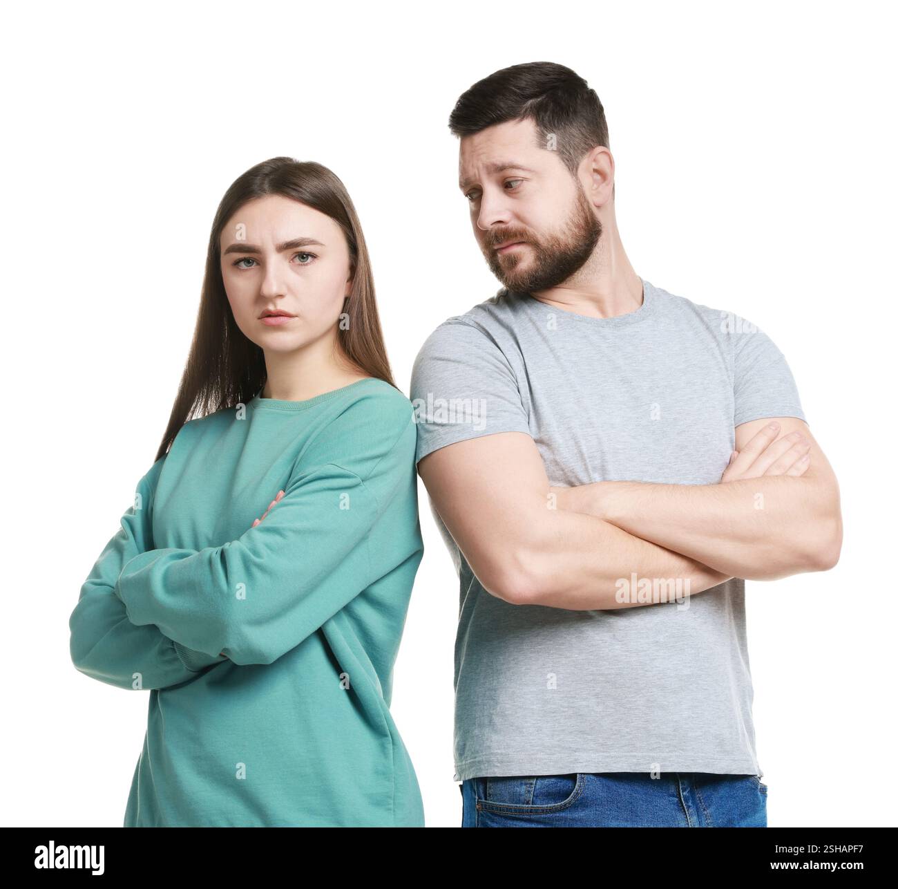 Resentful couple with crossed arms on white background Stock Photo - Alamy