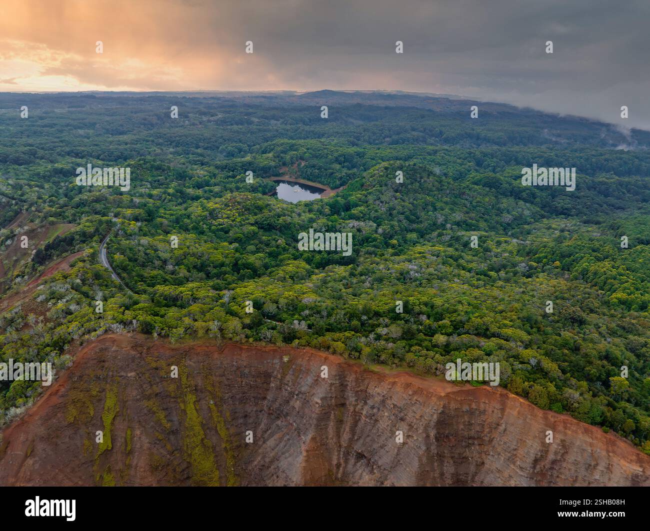 Aerial View of Kauai Island's Forest, Cliff, and Reflective Water Stock ...