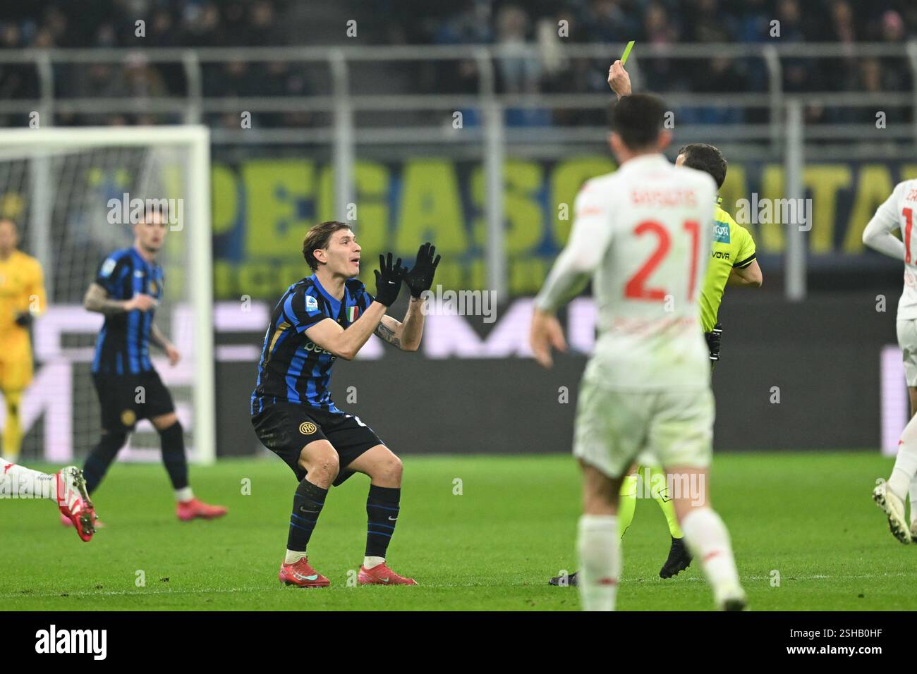 Milan, Italy. 10th Feb, 2025. Referee Federico La Penna shows yellow ...