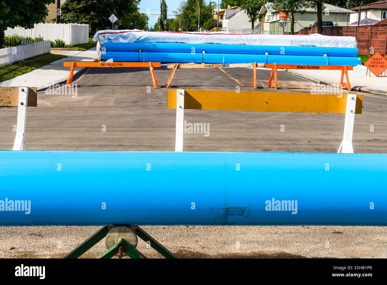 Road closure with PVS water supply pipes installation Stock Photo - Alamy