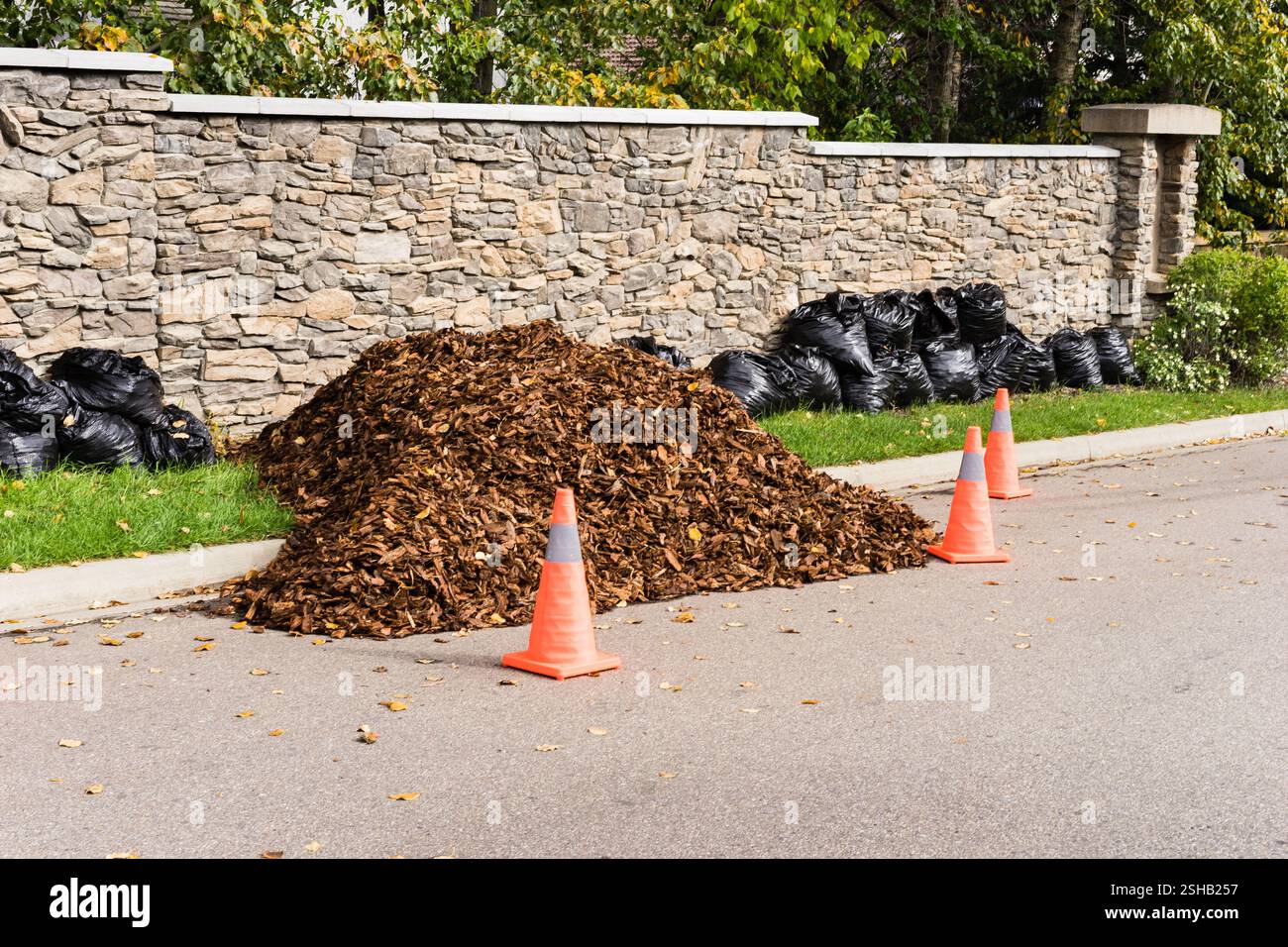 Pile of bark unloaded on toad edge for landscaping improvement work and ...