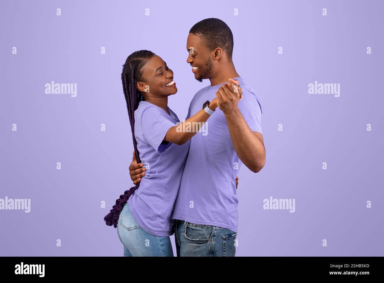 Portrait of romantic black couple dancing at studio Stock Photo - Alamy