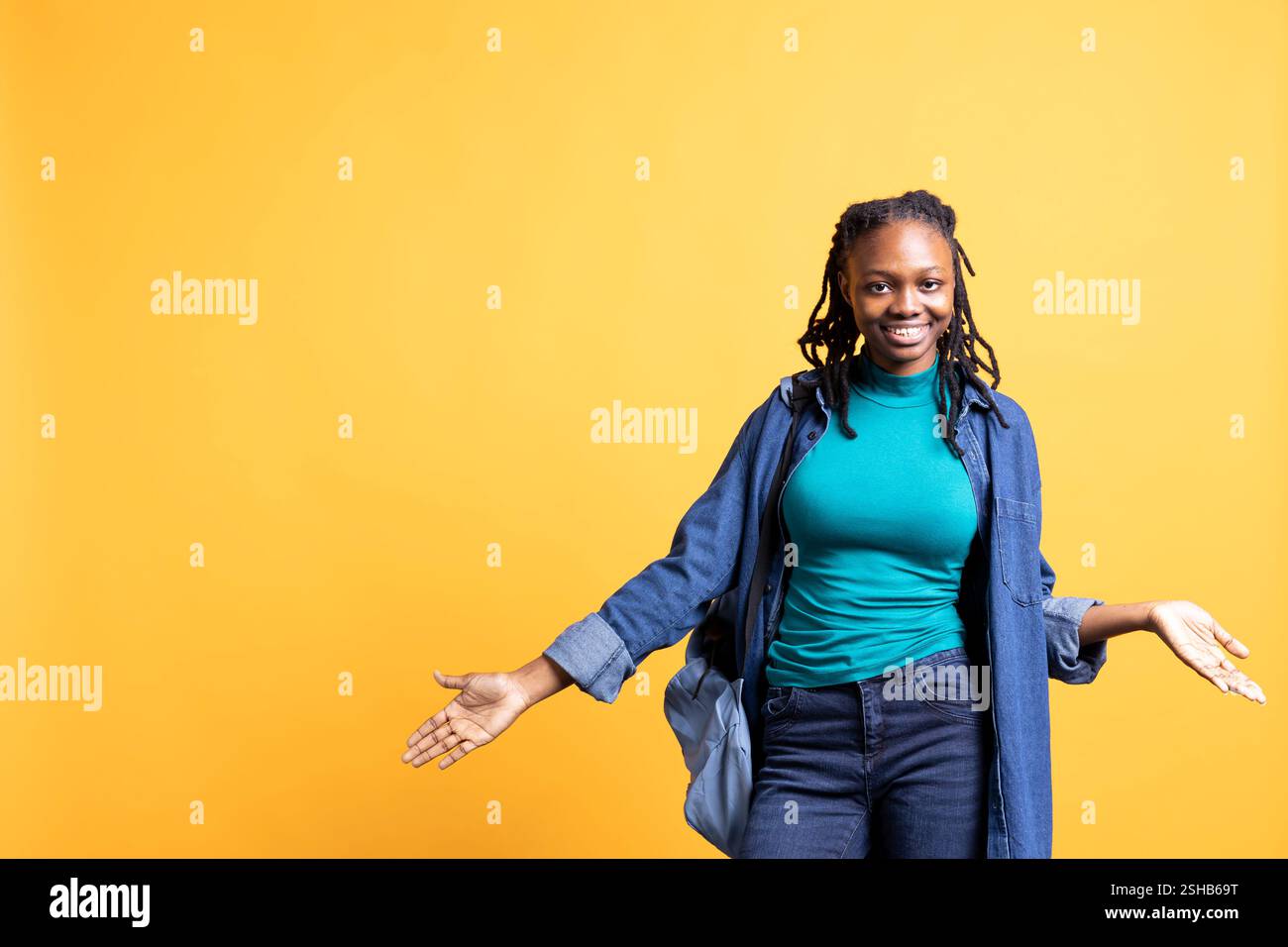Cheerful african american woman smiling, doing shrugging shoulders ...