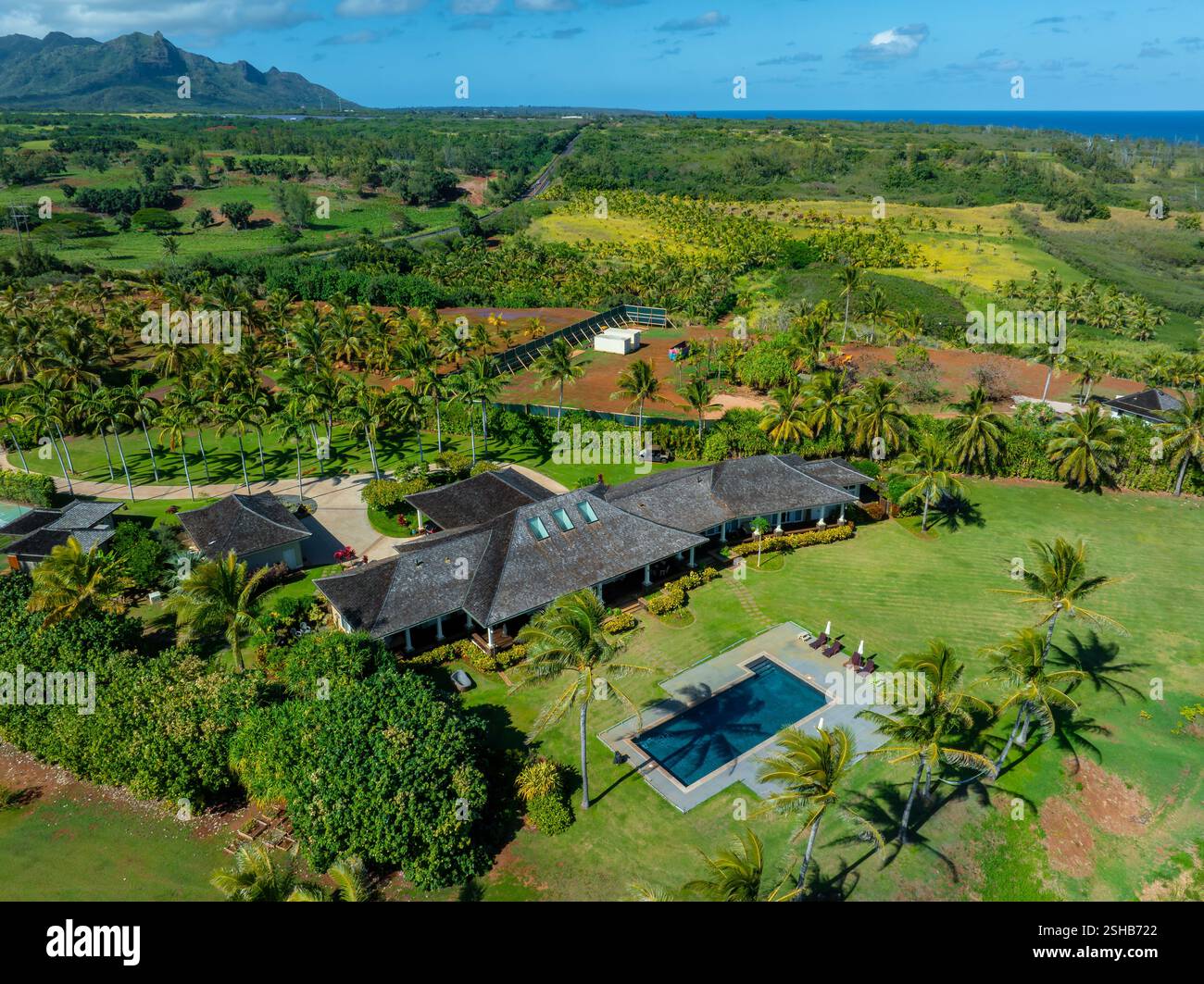 Aerial view of a modern property on Kauai Island with ocean horizon ...