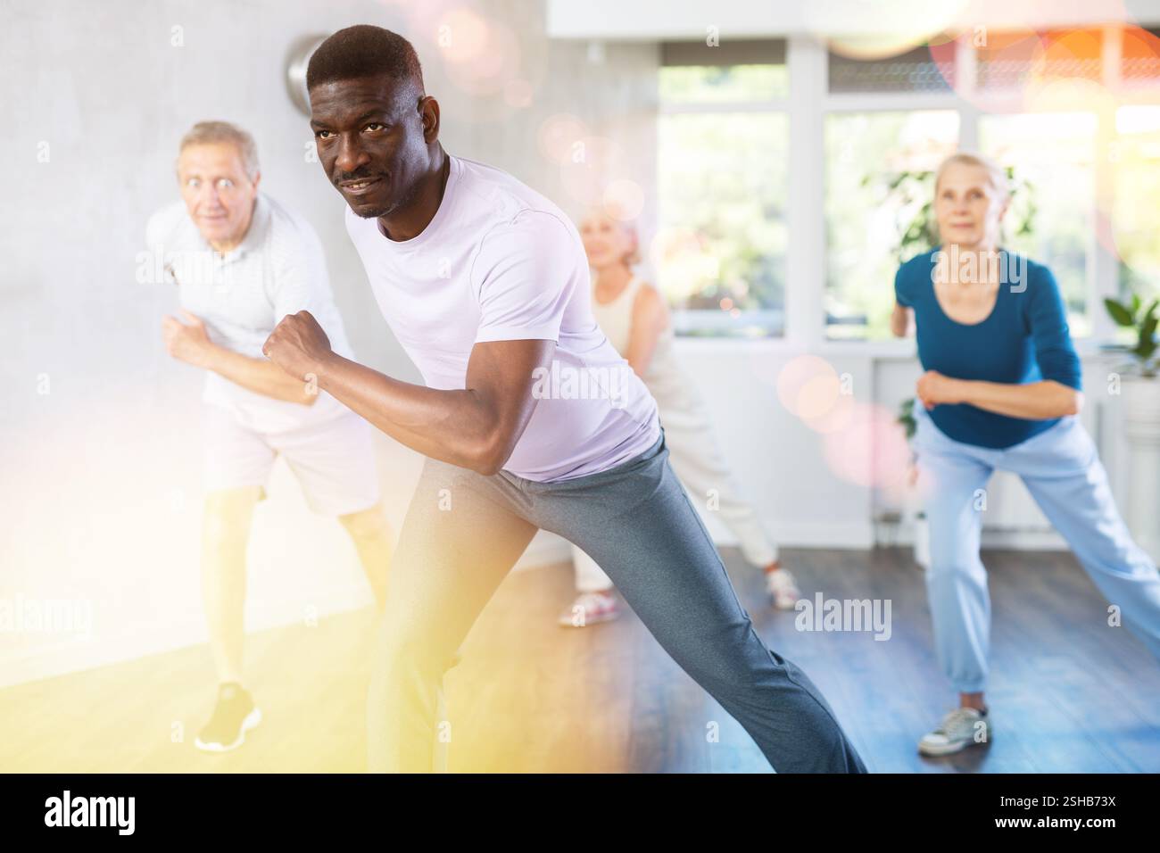 African American man practicing hip-hop during group dance class Stock ...