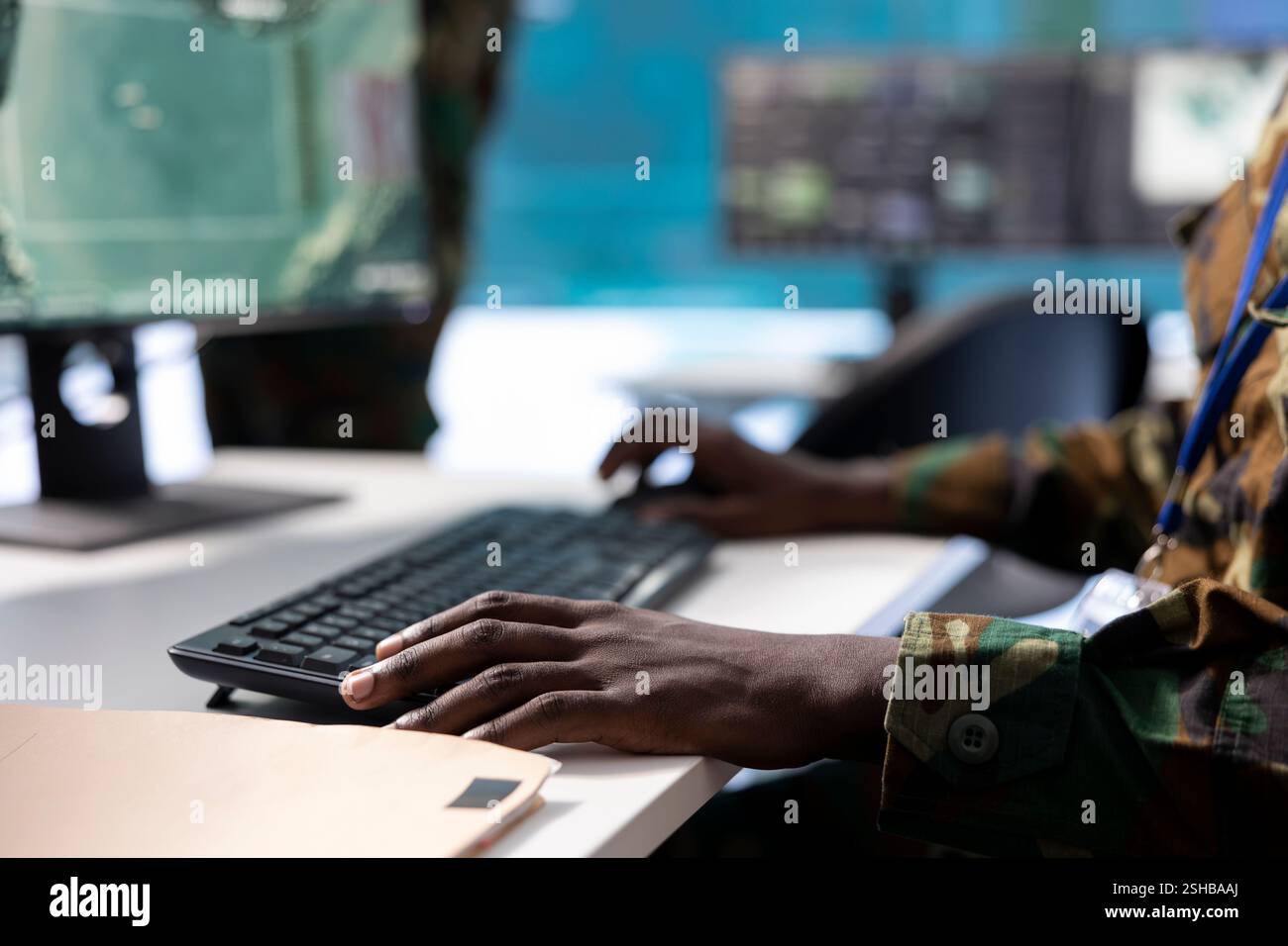 Government intelligence soldier in command center works on surveillance ...