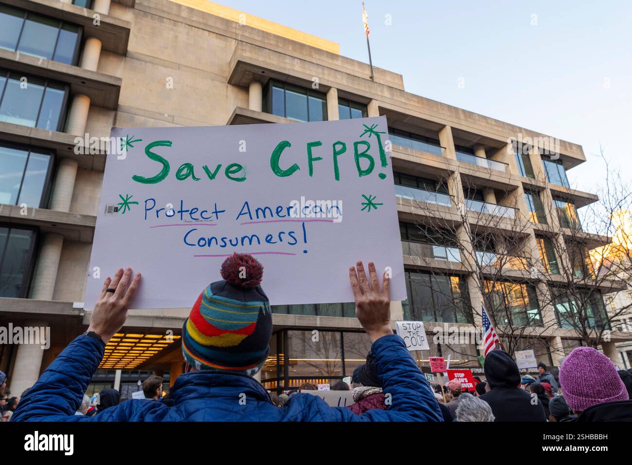 People attend a protest in support of the Consumer Financial Protection ...