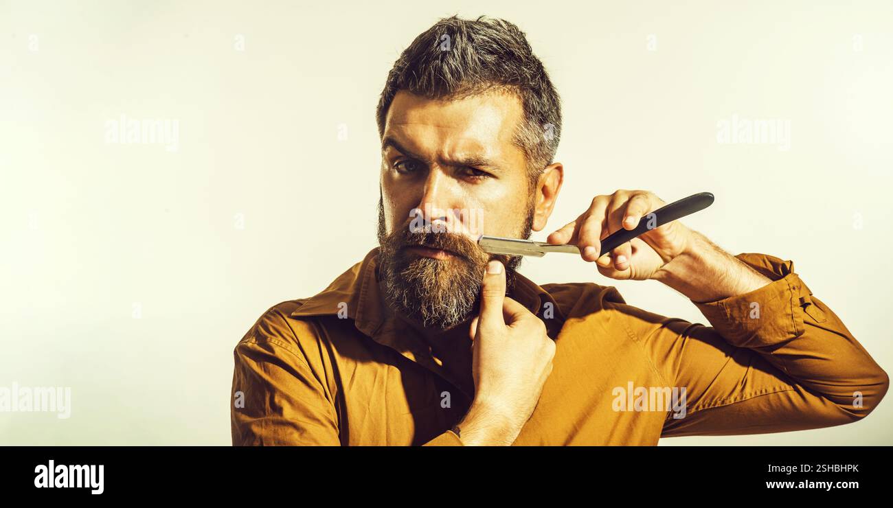 Classic shave at barbershop. Bearded man with vintage razor for shaving ...