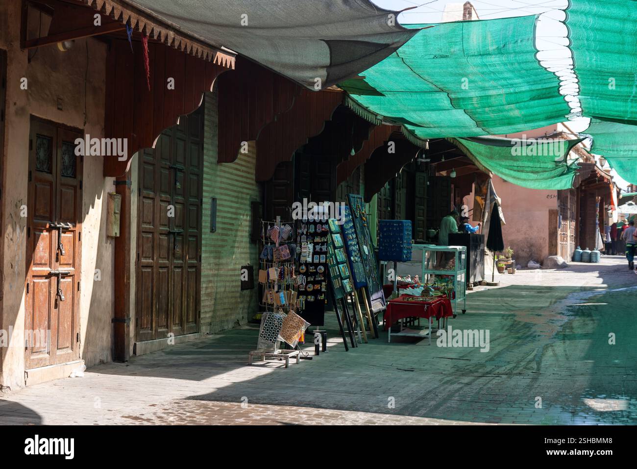 Souk of Marrakech Medina street life, tourists and locals walking ...