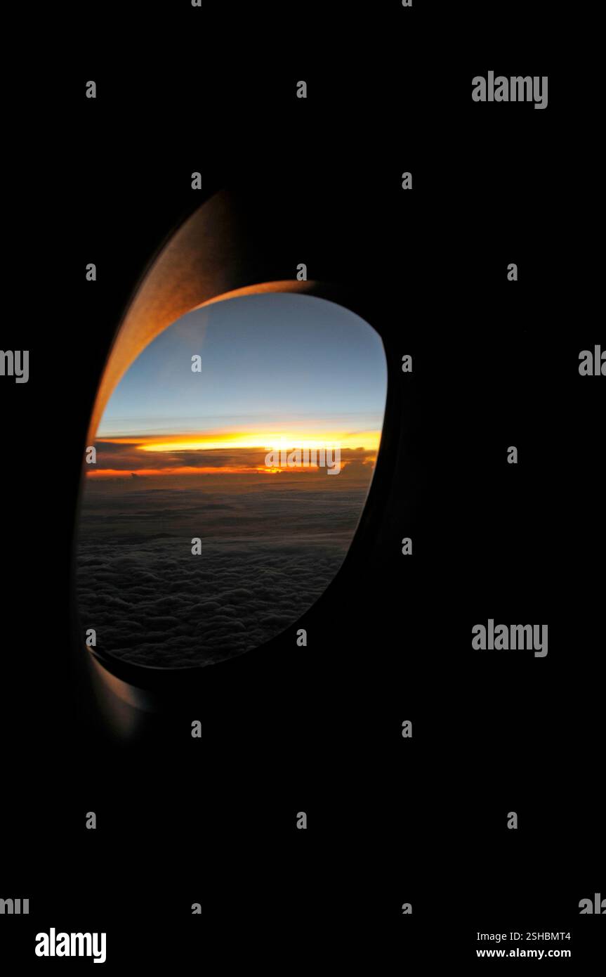 A view from an air passenger’s aircraft window of the first light of ...