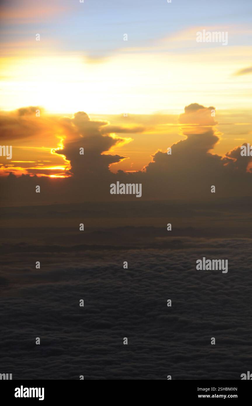 A view from an air passengerÕs aircraft window of the first light of ...