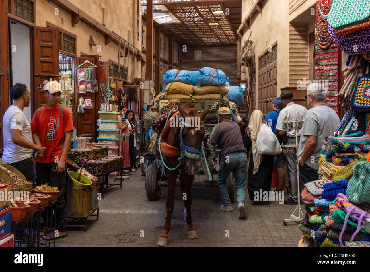 Horse carriage, Souk of Marrakech Medina street life, tourists and ...