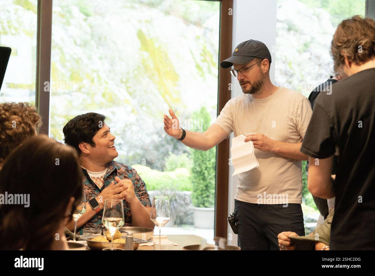 COMPANION, from left: Harvey Guillen, director Drew hancock, on set ...
