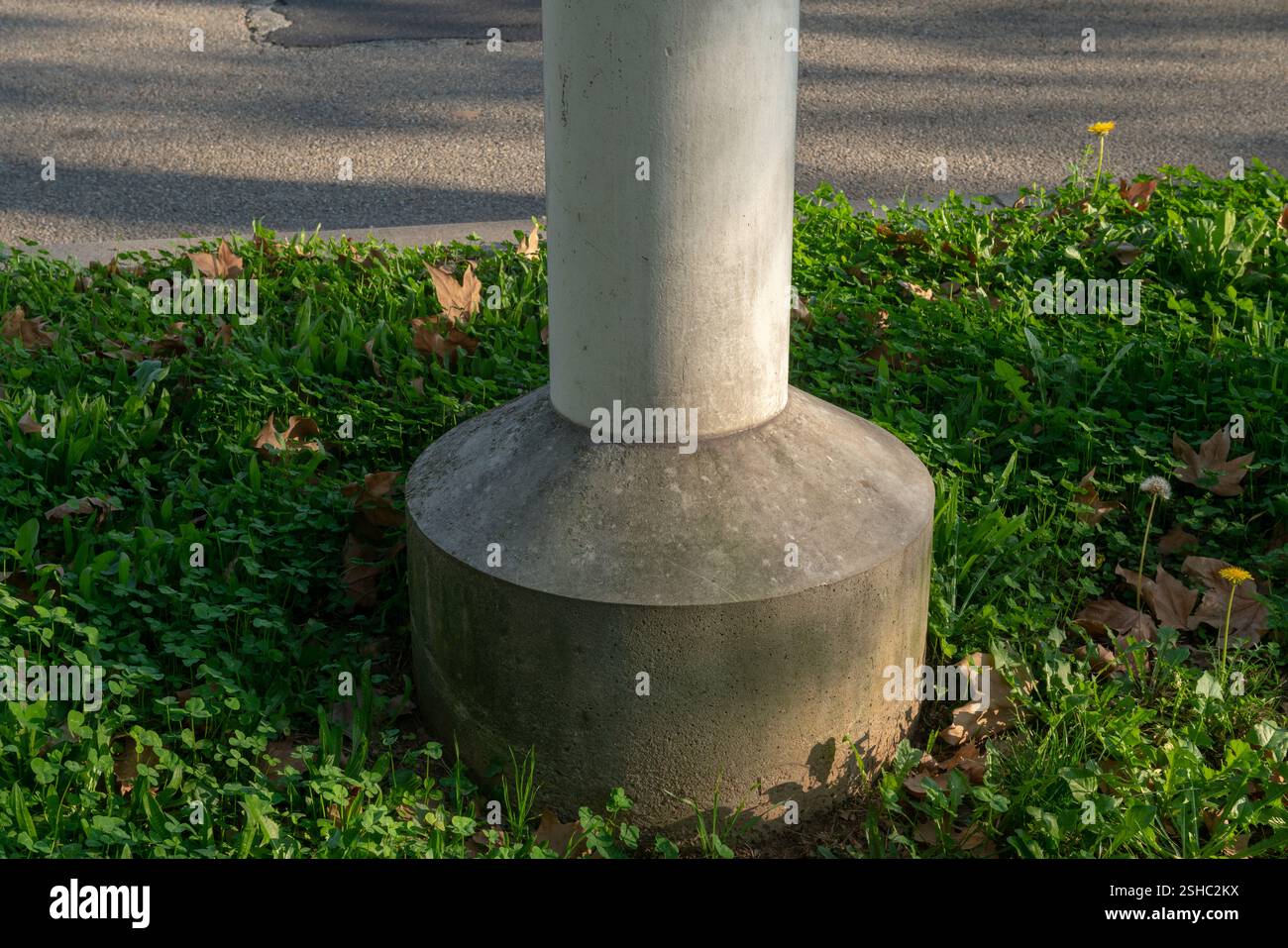 steel pillar, circular plinth with reinforced concrete at the base of a ...