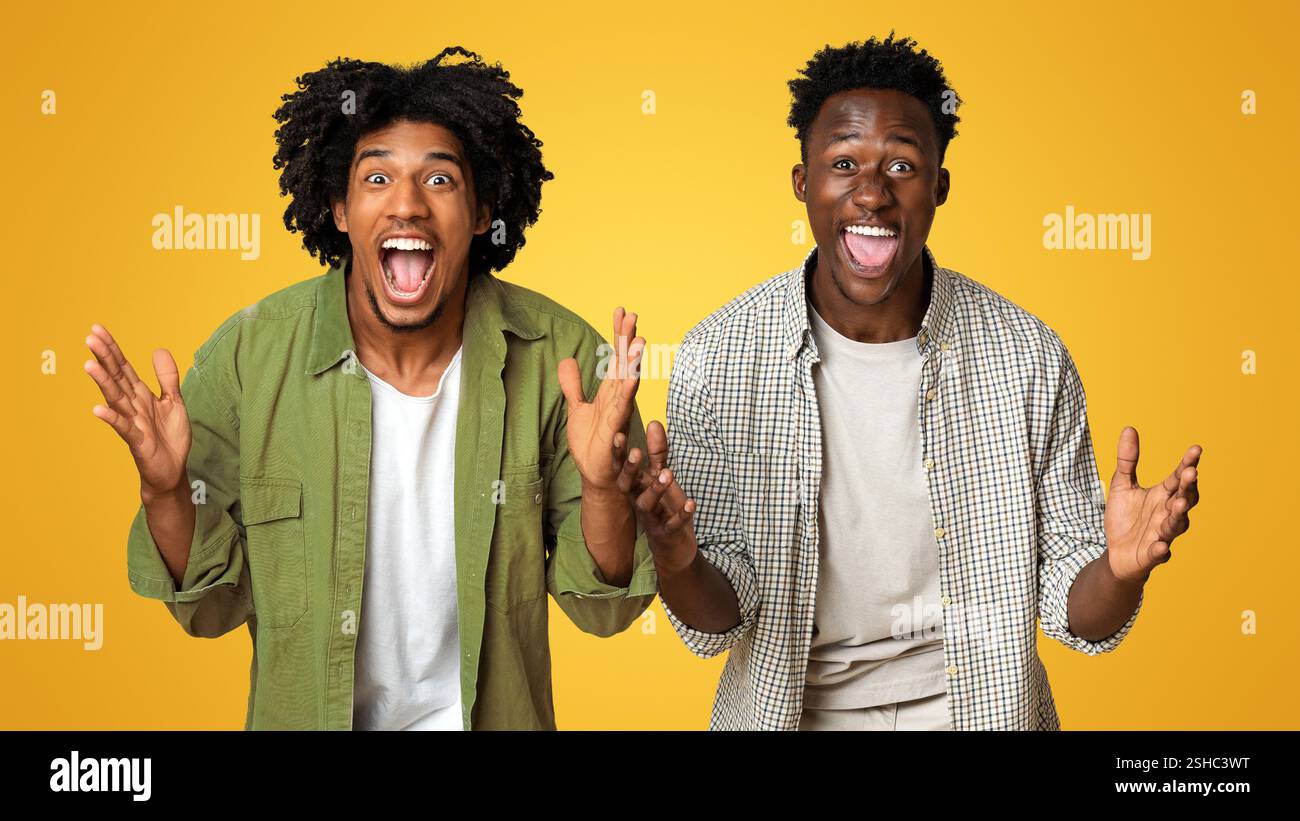 Two Excited Happy Black Guys Raising Hands And Opening Mouth In ...