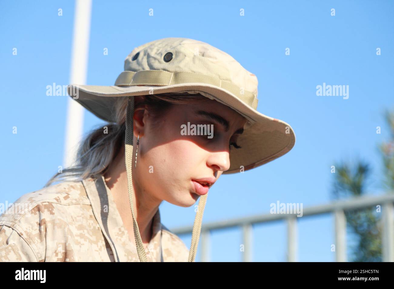 Tired And Bored Soldier Sitting On A Bench Stock Photo - Alamy