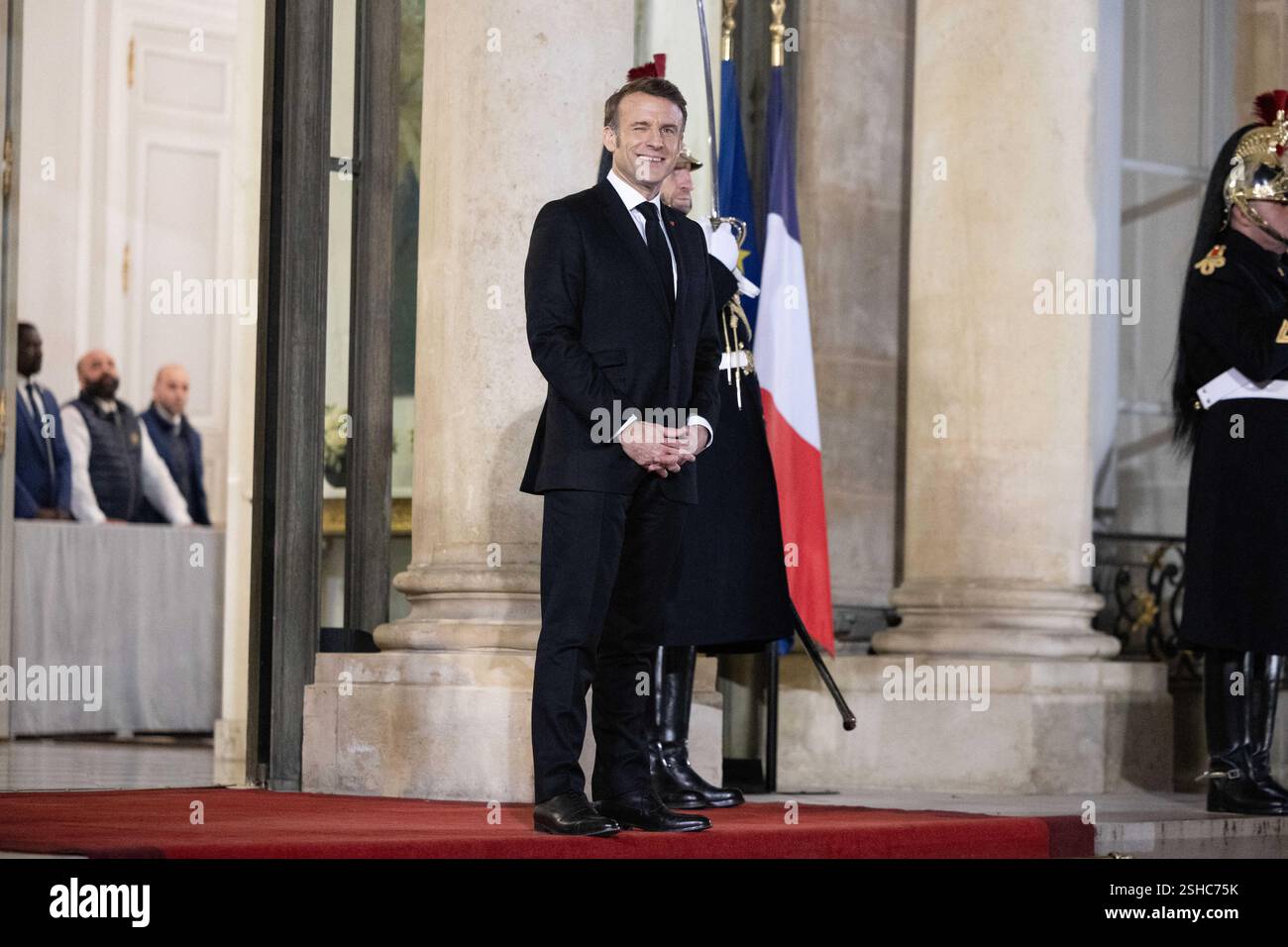 Paris, France. 10th Feb, 2025. French President Emmanuel Macron wink to ...