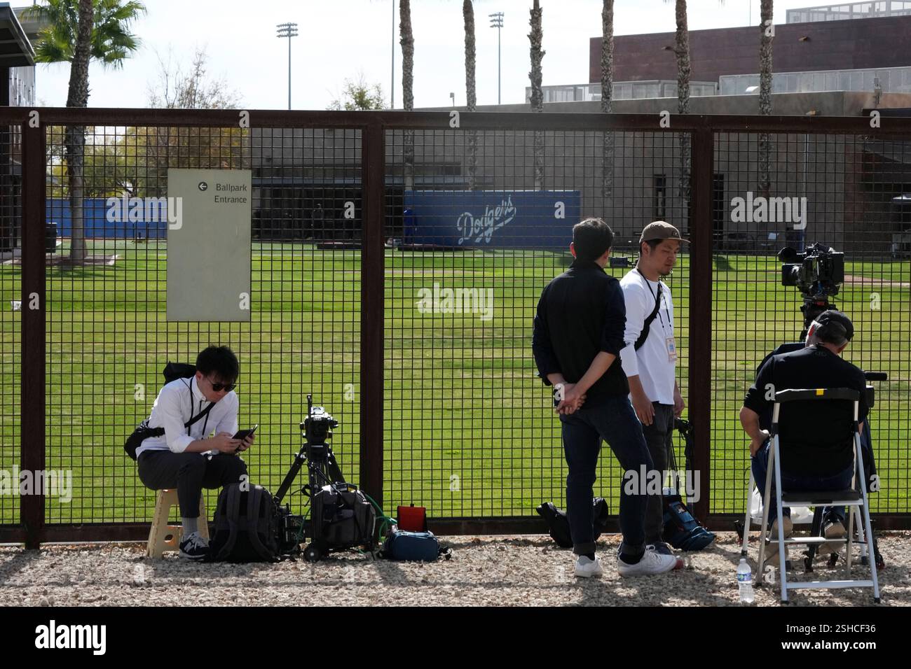 Members of the media stake out the Los Angeles Dodgers baseball spring ...